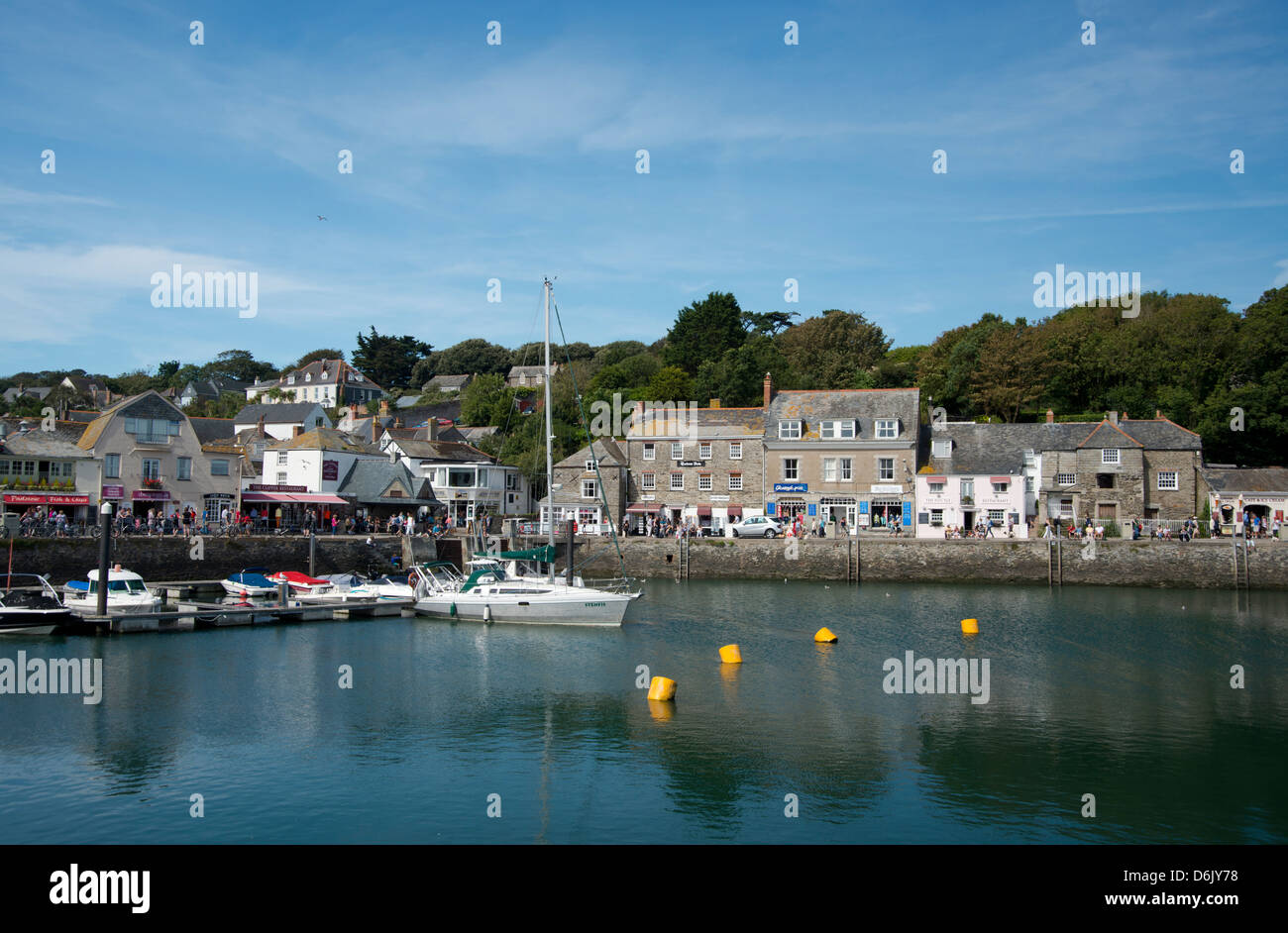 A view of the quaint stone buildings around the harbour in Padstow ...