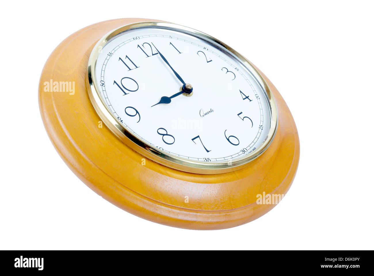 wooden wall clock showing 9 o'clock isolated on white Stock Photo - Alamy