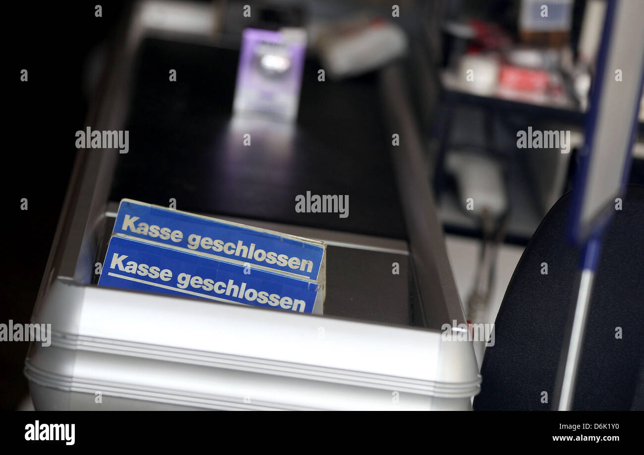 Signs reading 'Cash Register closed' are pictured at a closed Schlecker ...