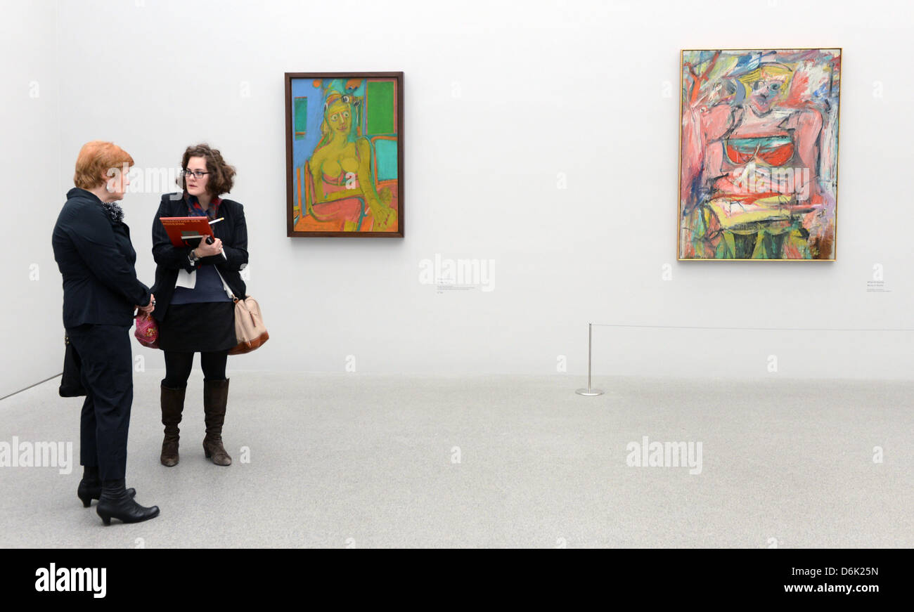 Curator Carla Schulz-Hoffmann (L) talks to a visitor in front of a set ...