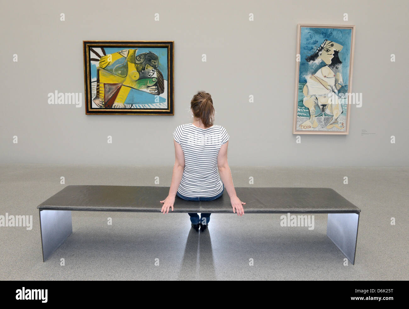 A visitor looks at a set of paintings 'Le Couple' (1969, L) and 'La ...