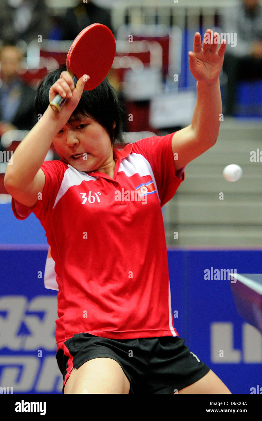 North Korea's Kim Hye Song hits the ball during the women's round of 16 ...