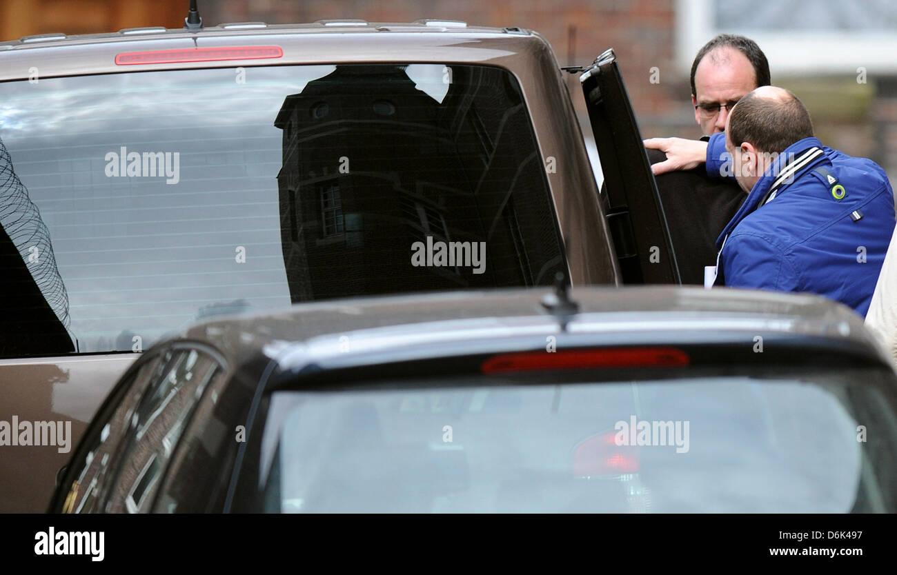 Police officers lead the covered suspect in the Lena murder case from ...