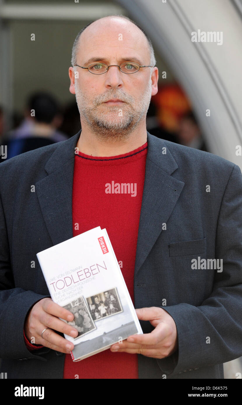 Uwe von Seltmann poses with his book at the Leipzig Book Fair, Germany, 16 March 2012. Photo ...