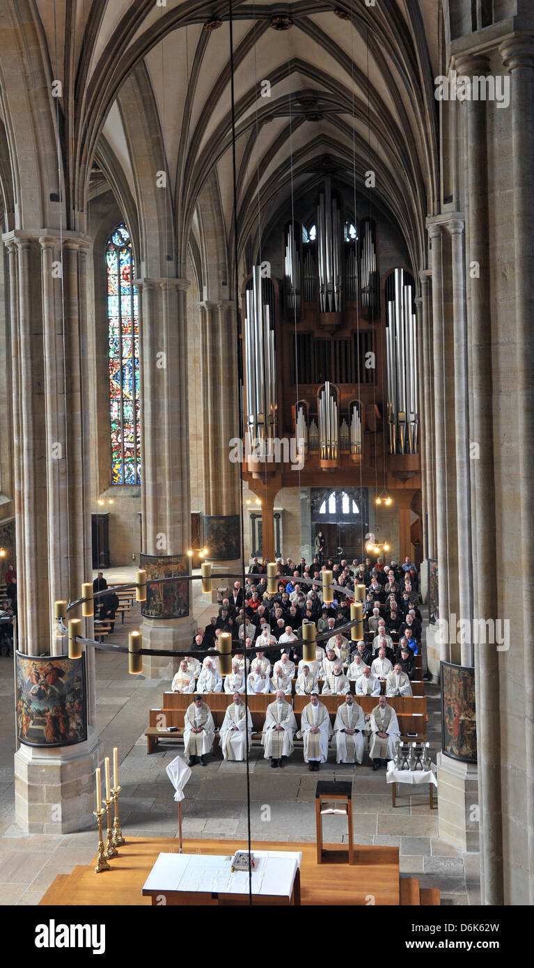 Catholic priests take part in the blessing of the three holy oils at ...