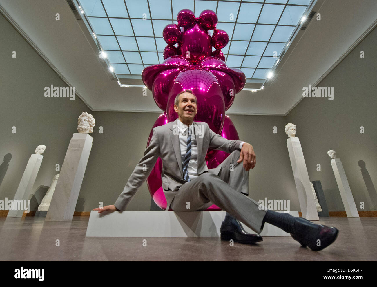 US artist Jeff Koons sits in front of his sculpture 'Balloon Venus' at ...