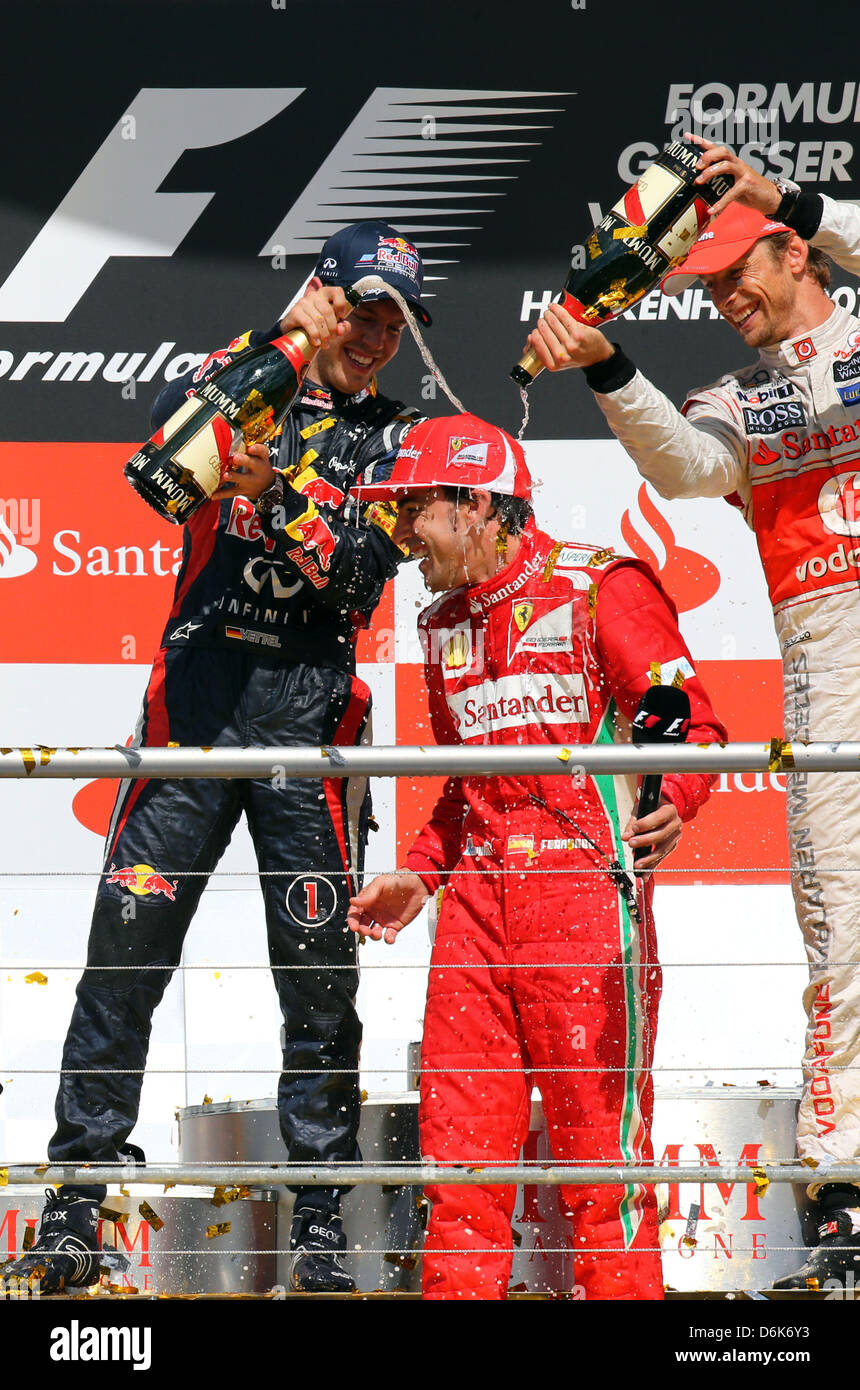 Spanish Formula One driver Fernando Alonso (C) of Ferrari celebrates ...
