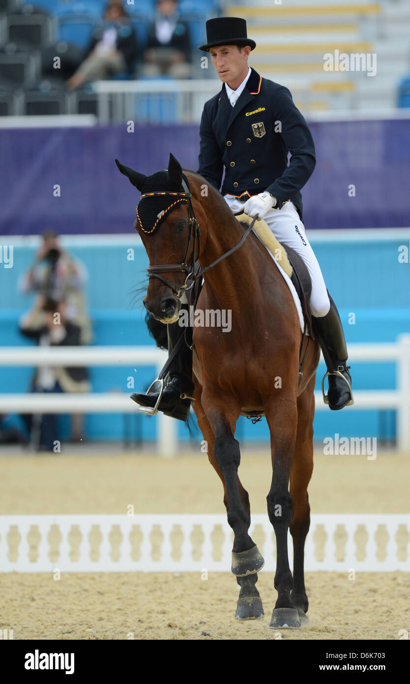 German eventing rider Dirk Schrade performs with his horse King Artus in the dressage at the ...