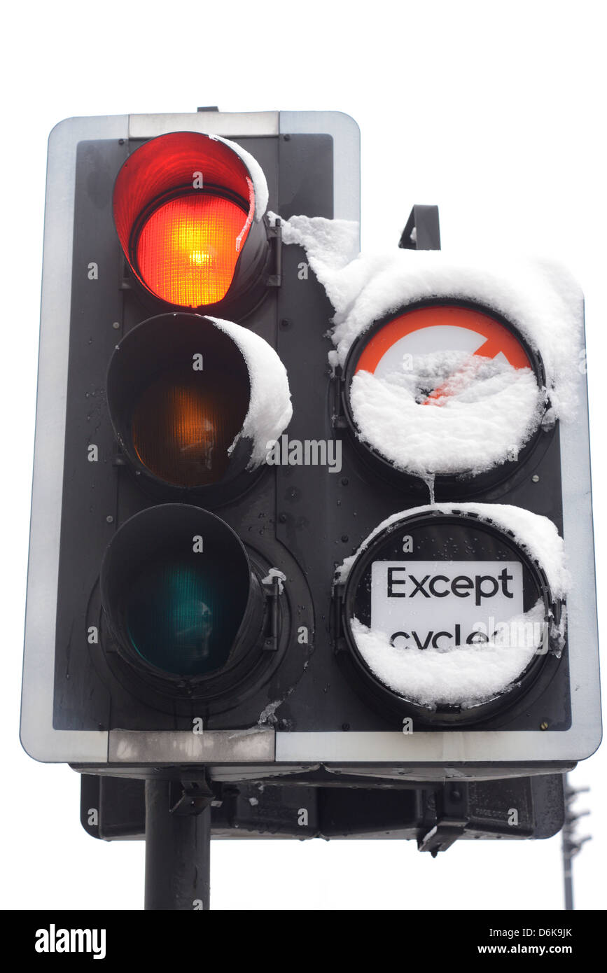 traffic light covered in snow showing red stop light united kingdom ...