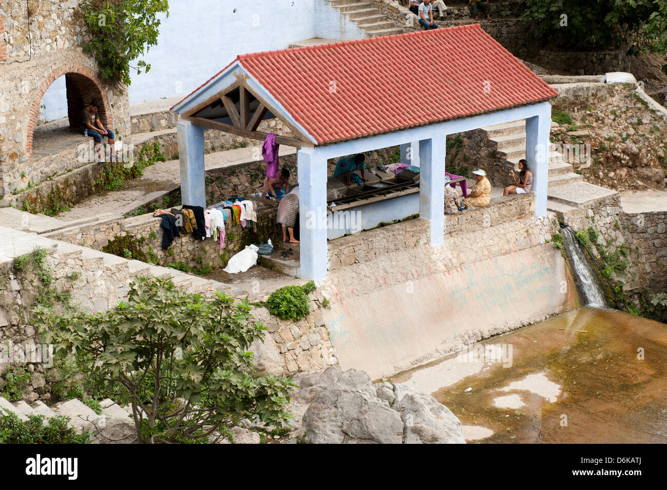 woman doing laundry, Chefchaouen, Morocco Stock Photo - Alamy