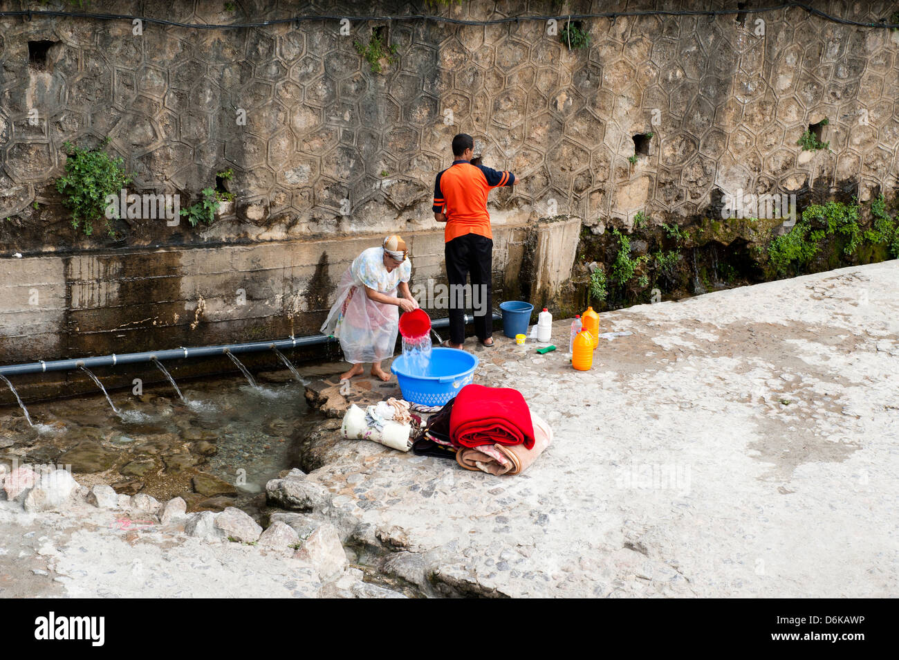 Old woman doing laundry, Chefchaouen, Morocco Stock Photo - Alamy