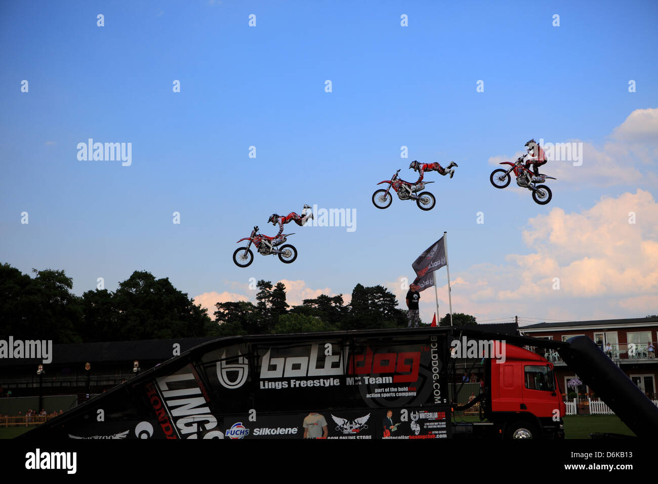 Bold Dog Stunt Motorcycle Team jumping with 3 riders Stock Photo - Alamy