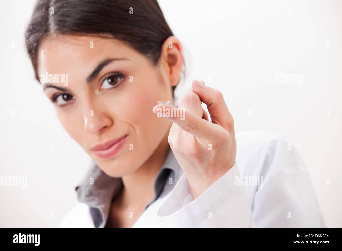 Female Optometrist With Contact Lens Stock Photo - Alamy