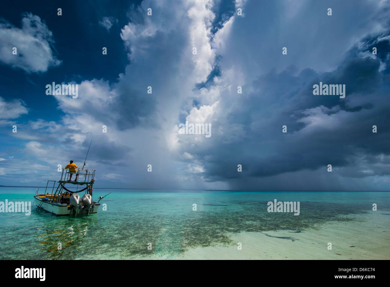 Little motor boat in the turquoise waters of the Ant Atoll, Pohnpei ...