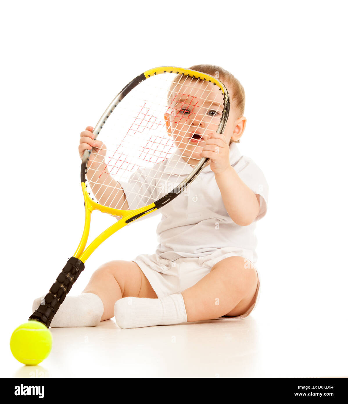 adorable child floor and playing with tennis racket and ball over white ...