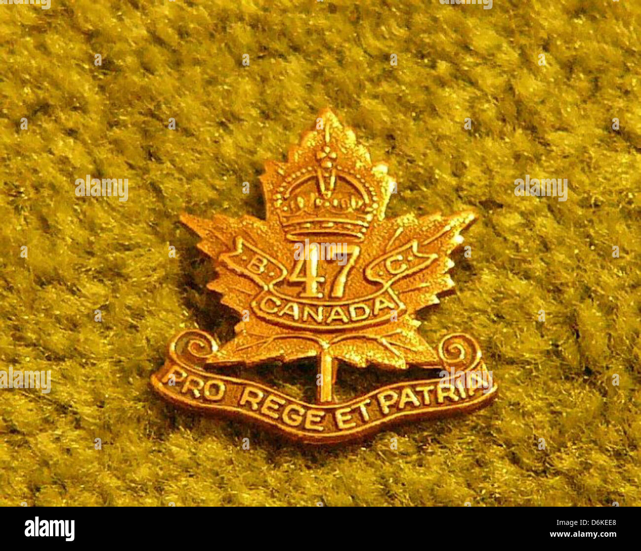 The image features the collar badge of the 47th Battalion, CEF ...