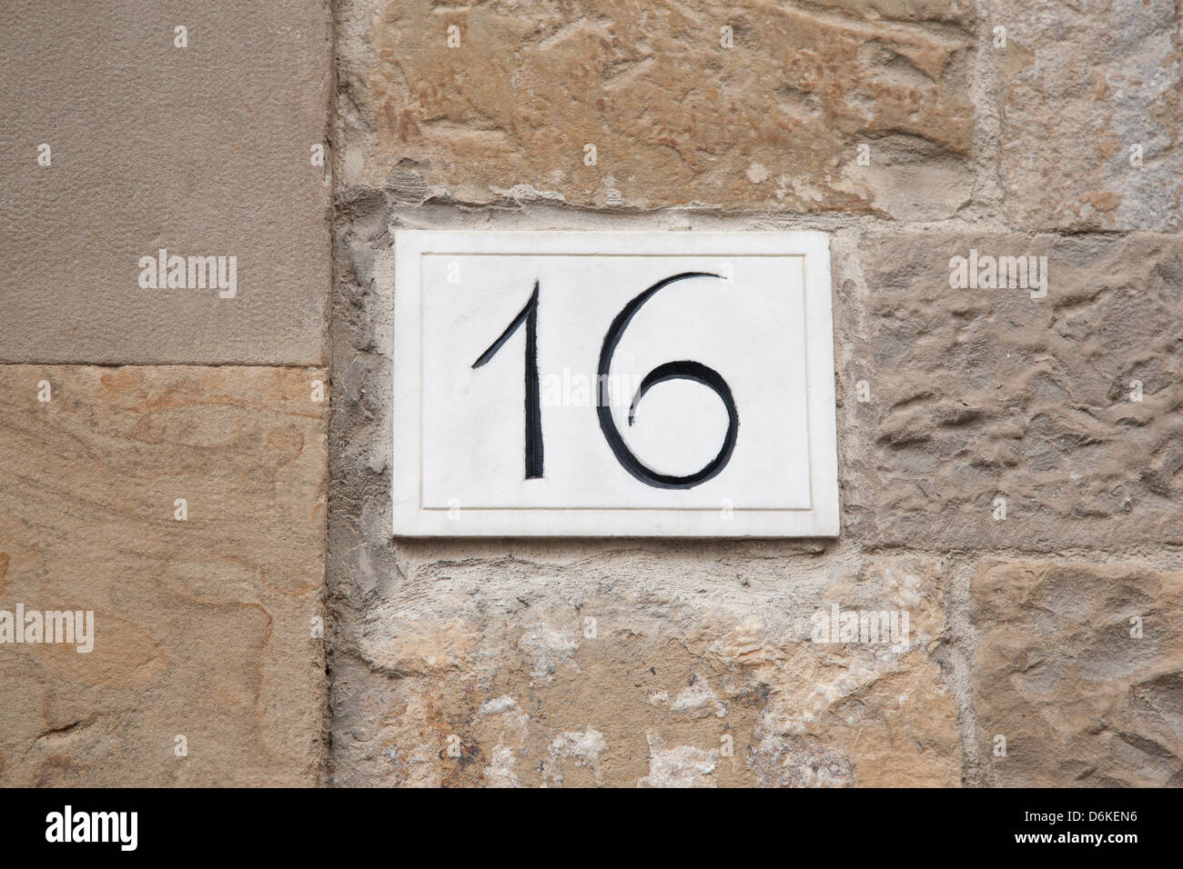 Number Sixteen on Plaque on Stone Wall Stock Photo - Alamy