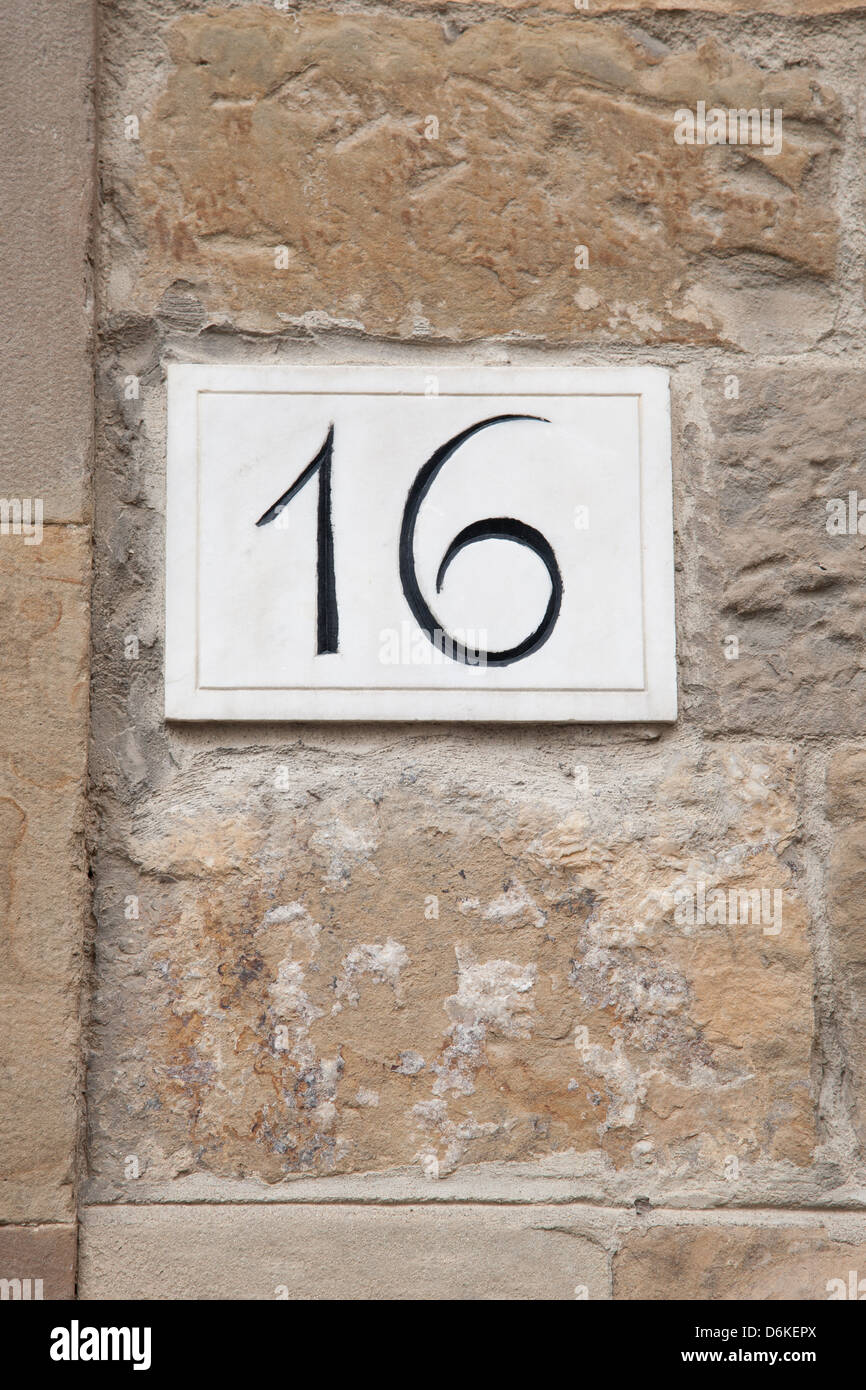 Number Sixteen on Plaque on Stone Wall Stock Photo - Alamy