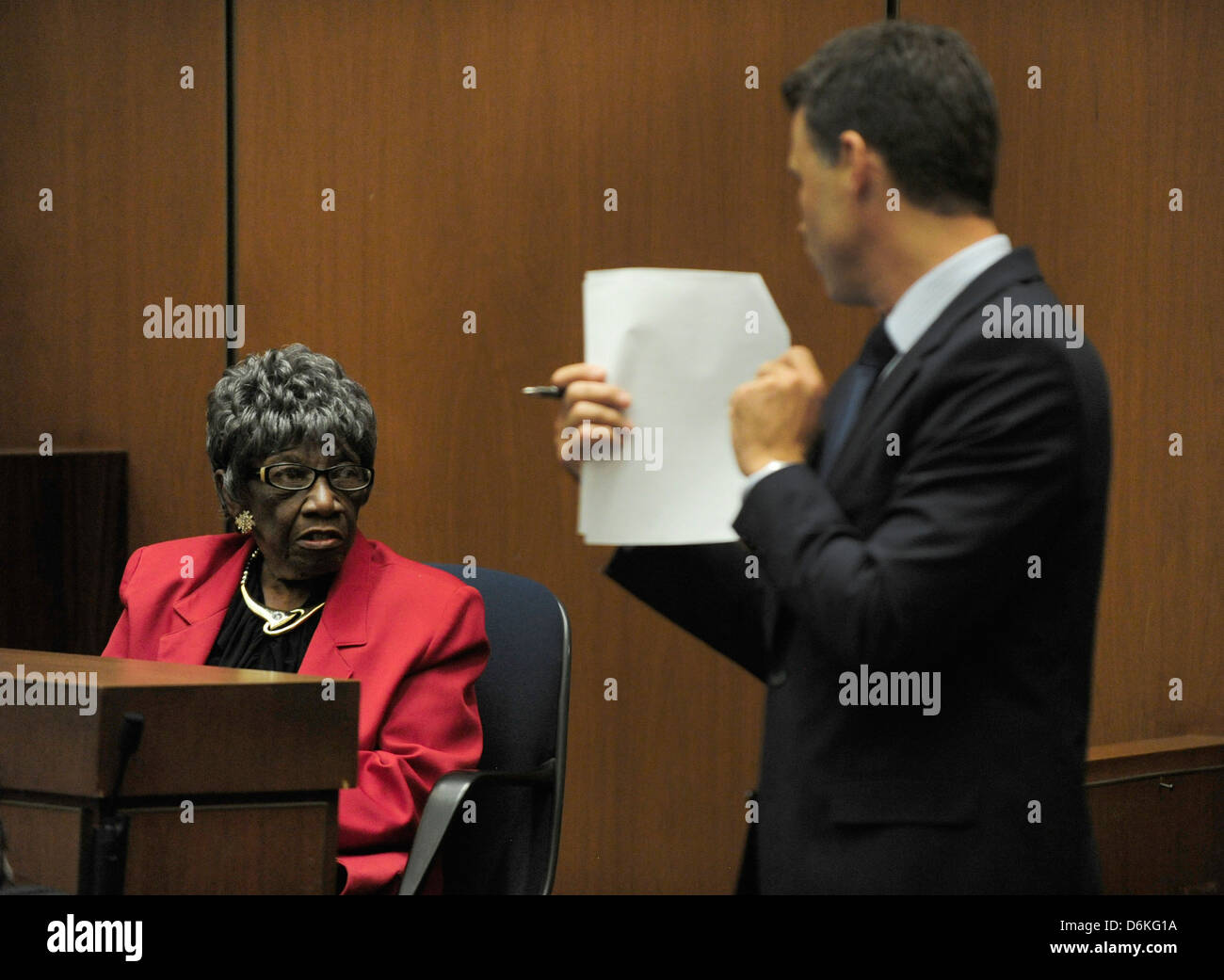 Deputy District Attorney David Walgren (R) hold a statement up for Ruby ...
