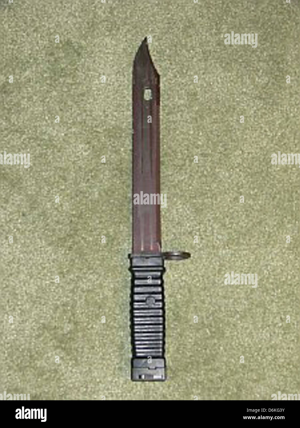 A close-up view of a bayonet, a blade designed to attach to the muzzle ...