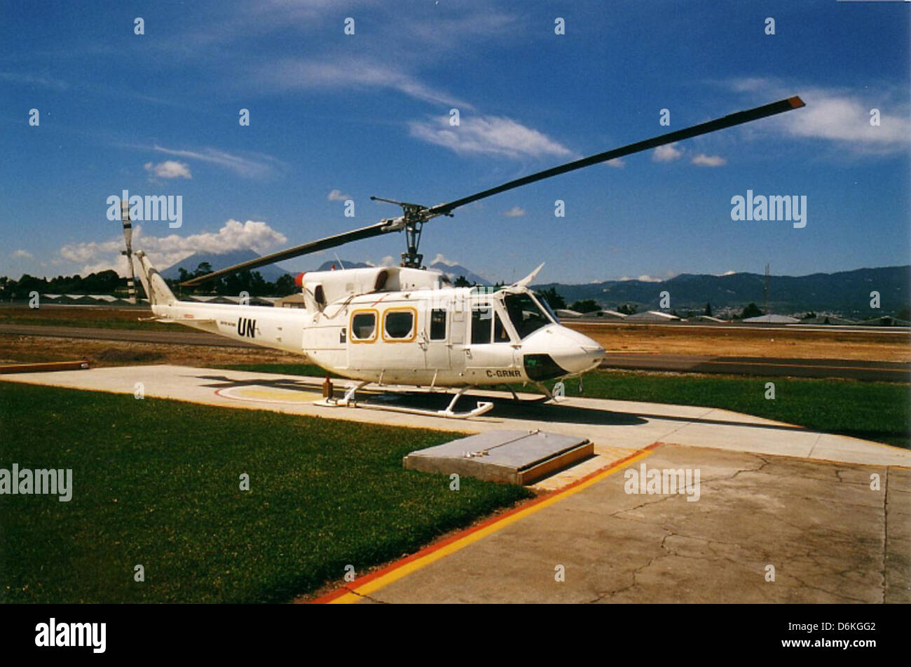 This image depicts the Bell 212 C-GRNR, a versatile twin-engine ...