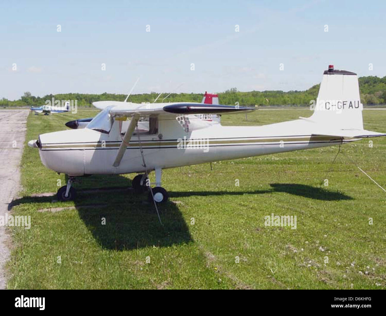 This image features a Cessna 150E (C-GFAU), a light two-seater aircraft ...