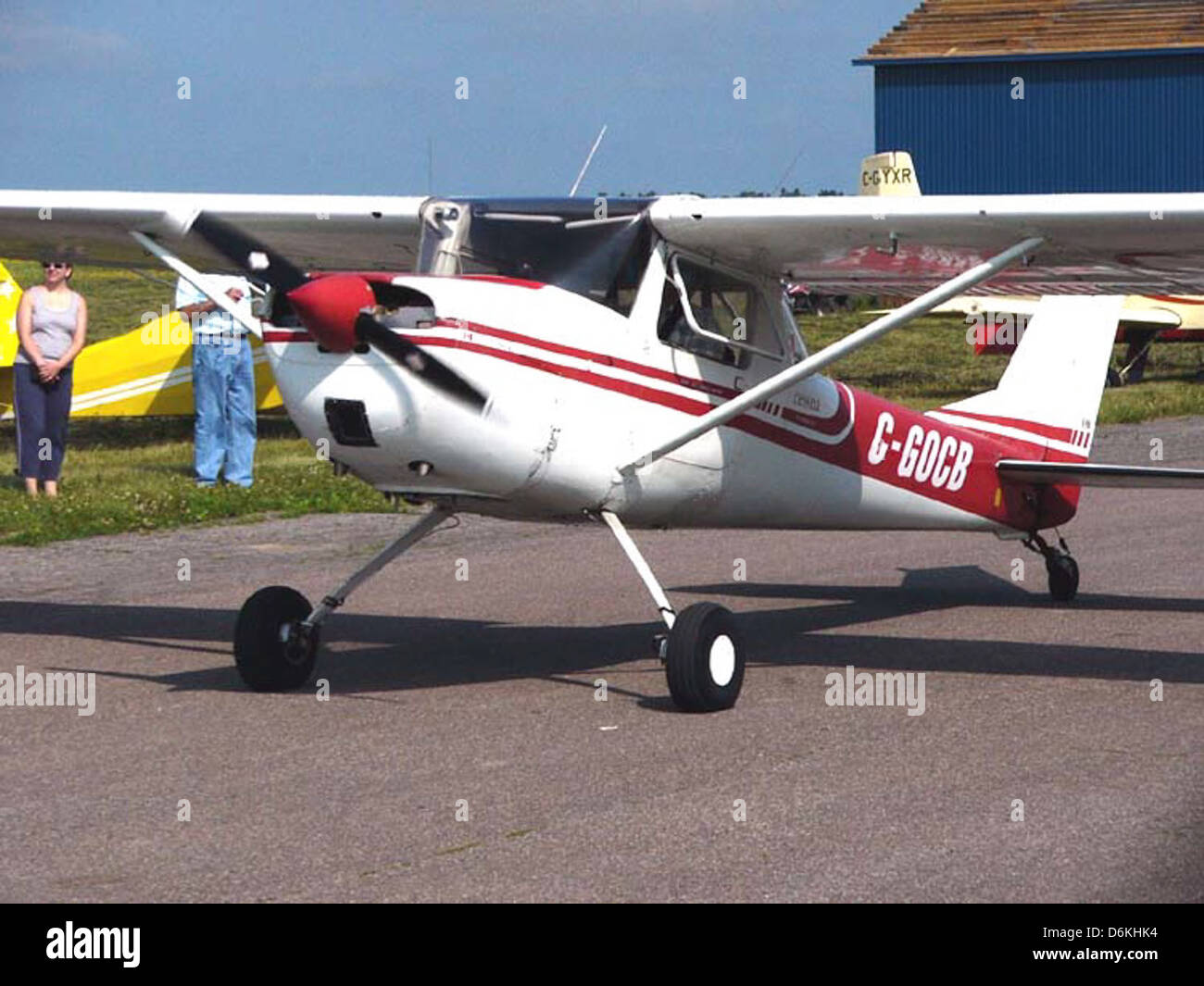 A Cessna 150 taildragger aircraft on the ground, captured in flight or preparation for takeoff ...