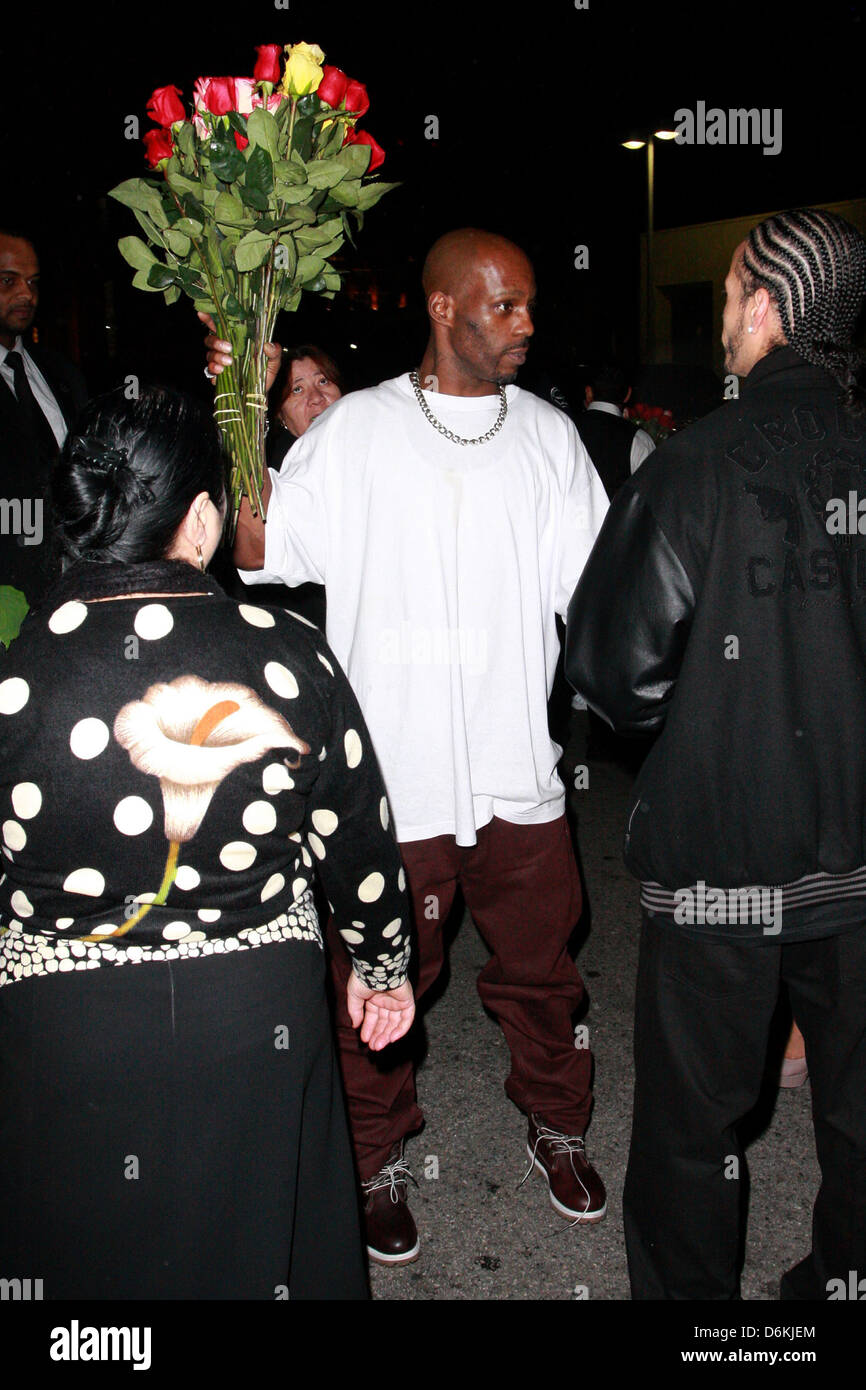 DMX aka Earl Simmons rapper holding a bouquet of roses while leaving ...