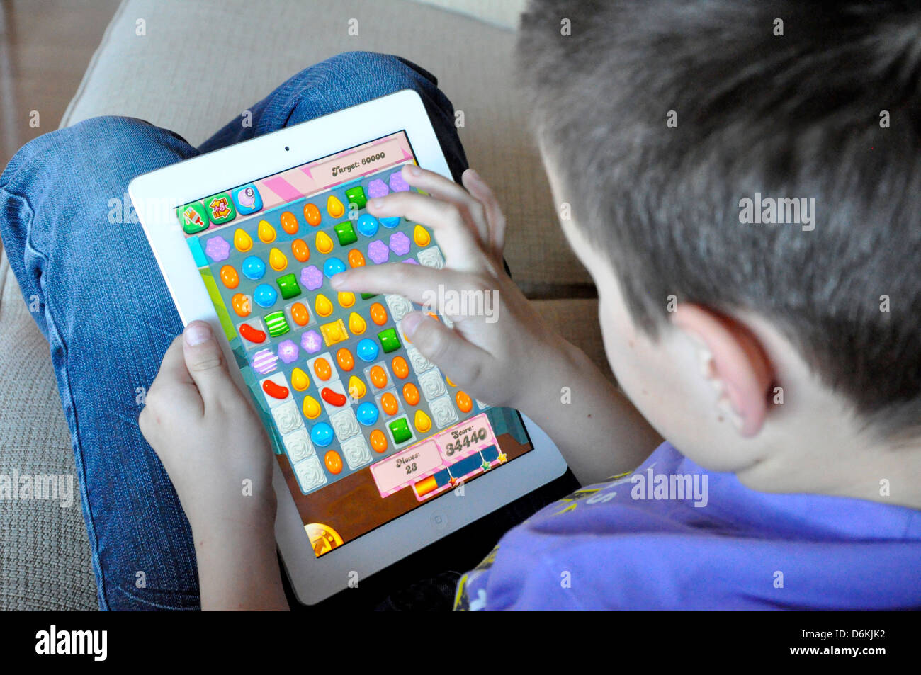 candy crush saga game ipad boy playing addicted winning concentrate ...