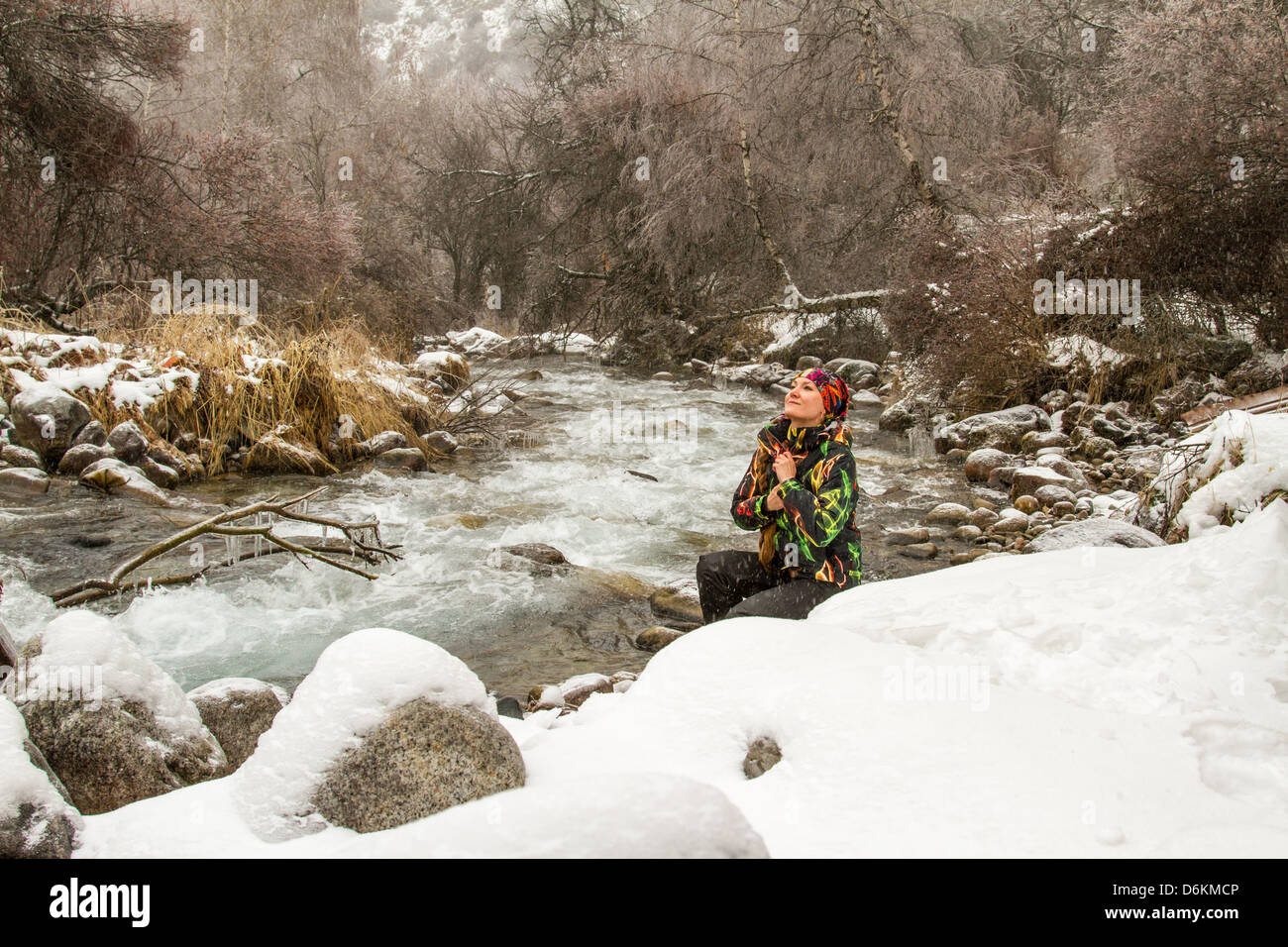 Beautiful woman in ski suit in snowy winter outdoors, Almaty ...