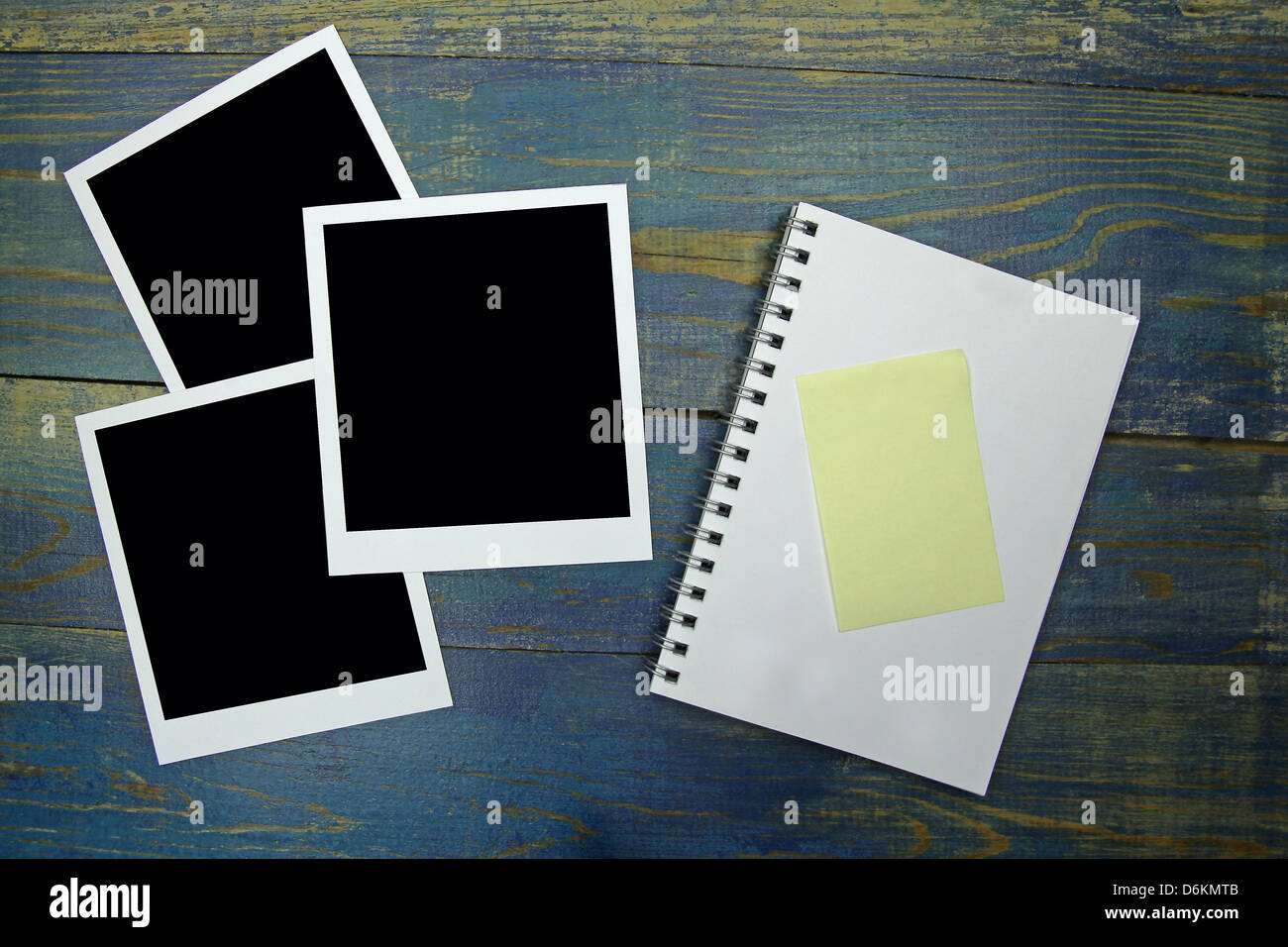 spiral notebook with sticker and three photo frames Stock Photo - Alamy