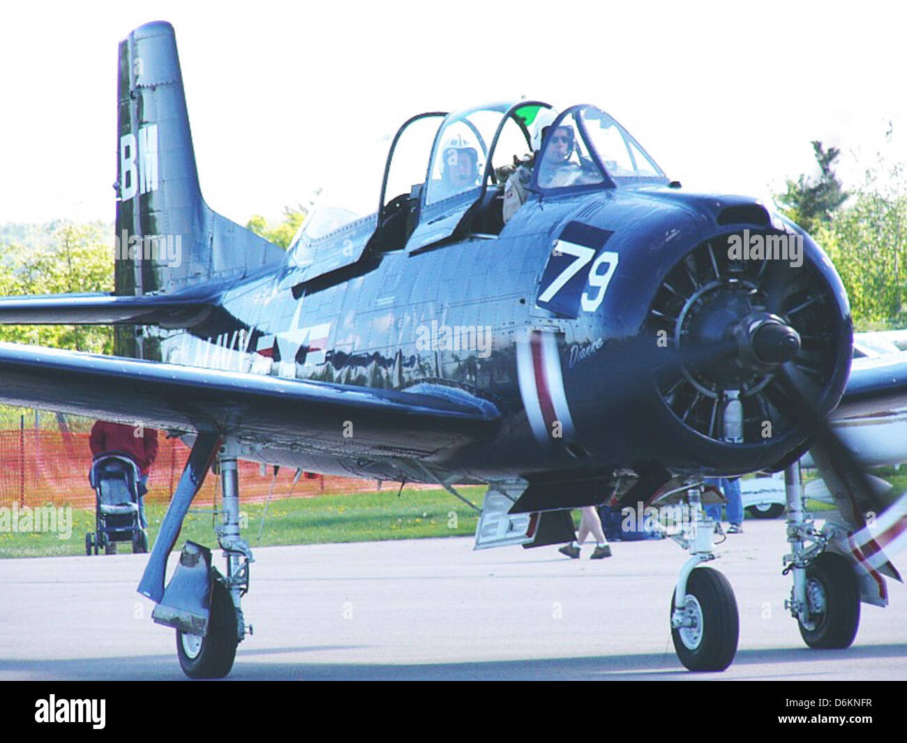 This image features the North American T-28C Trojan, a vintage military ...