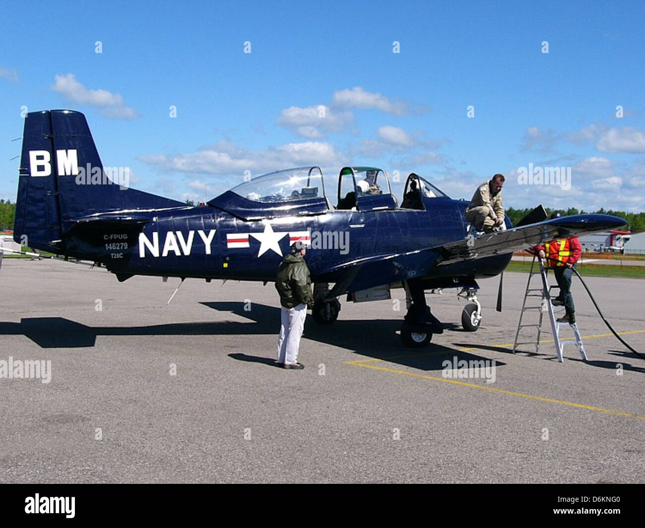 This image features the North American T-28C Trojan C-FPUG aircraft, a ...