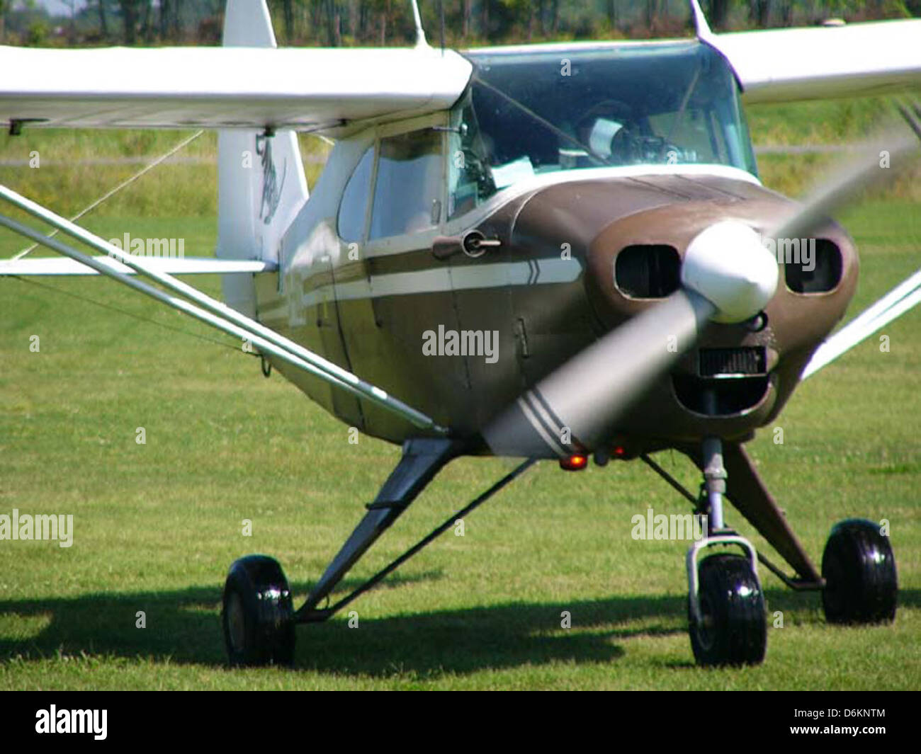 A Piper PA-22-135 Tri-Pacer, a light aircraft, shown on the ground ...