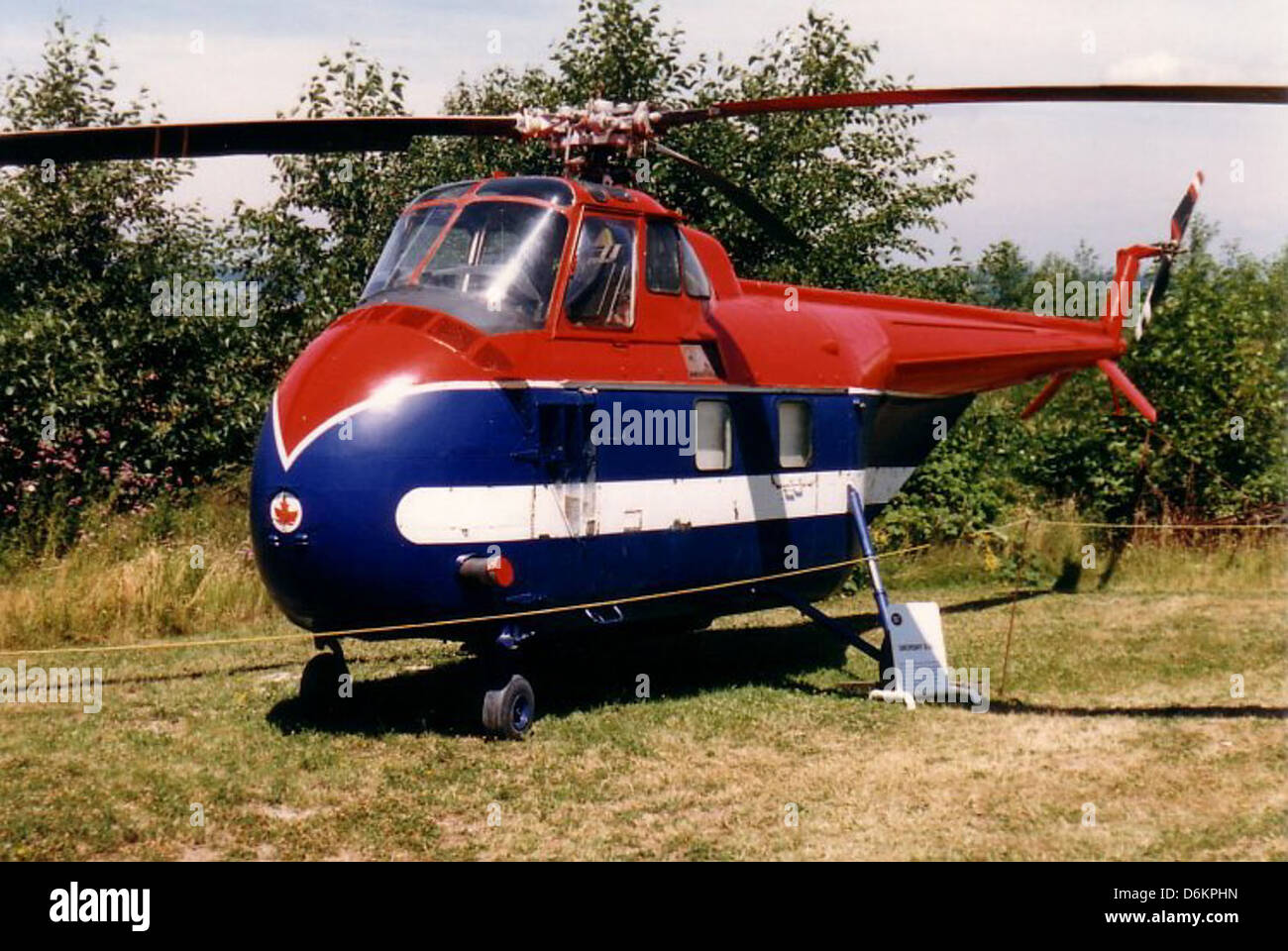 The image showcases an S-55 helicopter, a mid-sized aircraft used for ...