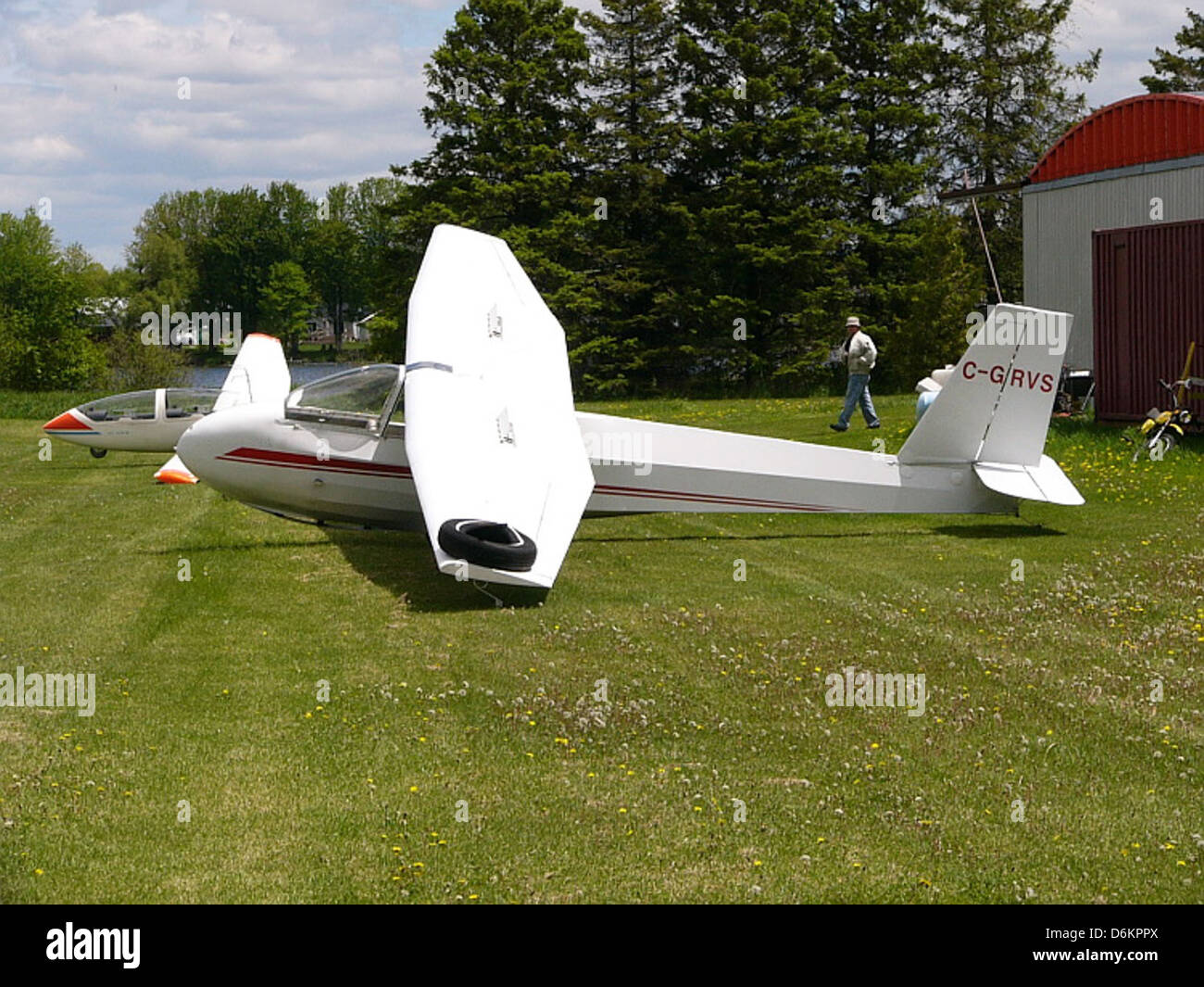 The image features a Schweizer SGS 2-33C glider in flight, a light ...