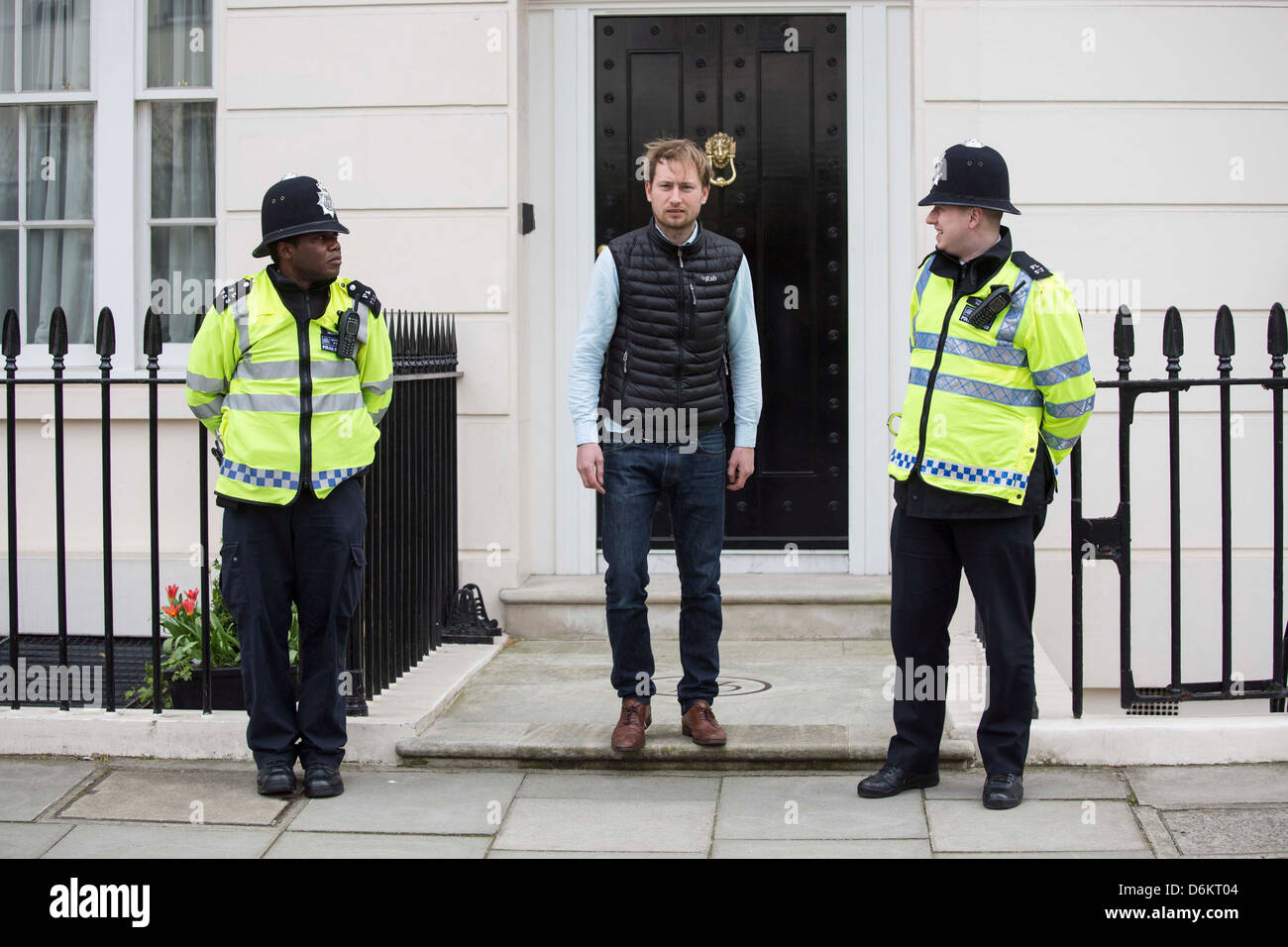 Two policemen guarding home in London Stock Photo - Alamy