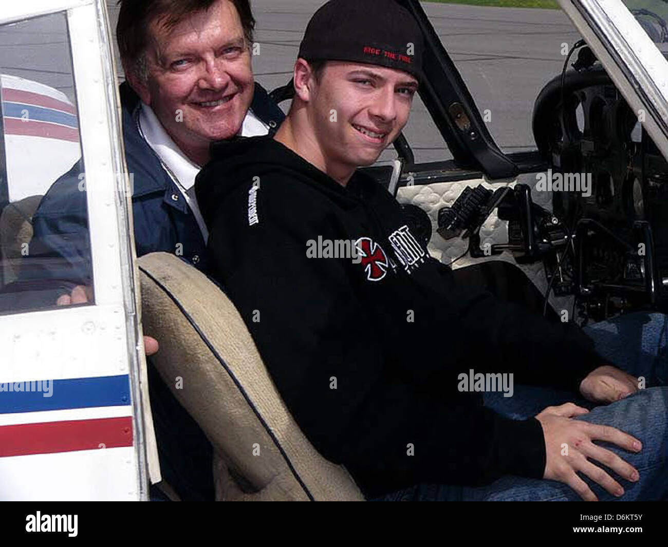 A photograph capturing a young eagle in flight. The bird is soaring ...