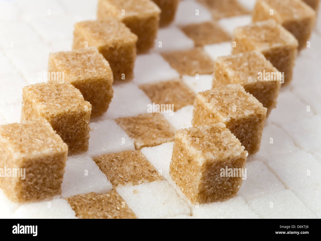 Cubes of not refined reed sugar and white sugar Stock Photo - Alamy