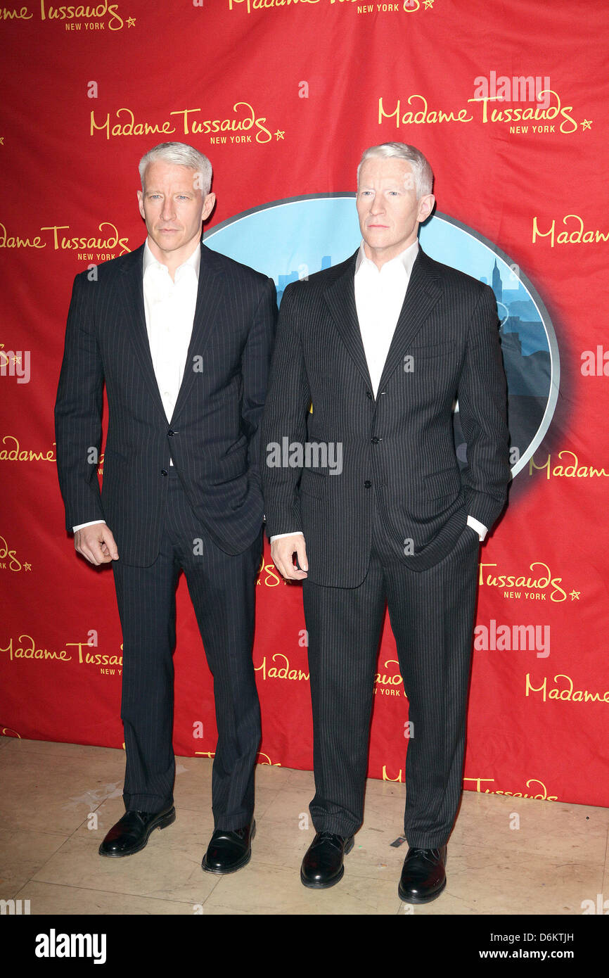 Anderson Cooper attends the unveiling and poses next to his new wax ...