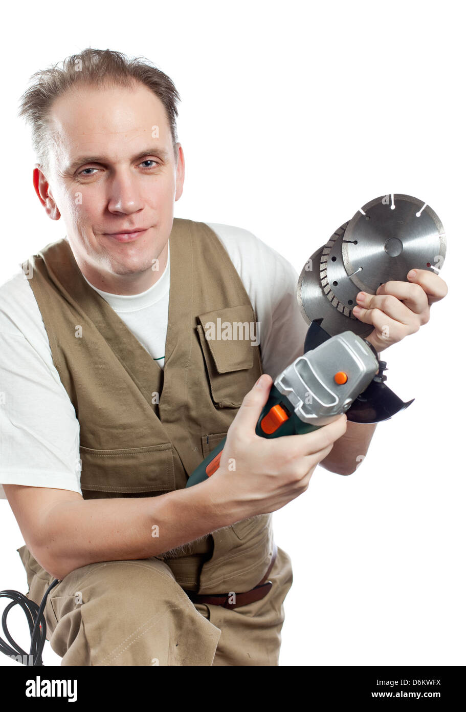 The man, the builder, chooses a detachable disk for the tool Stock ...