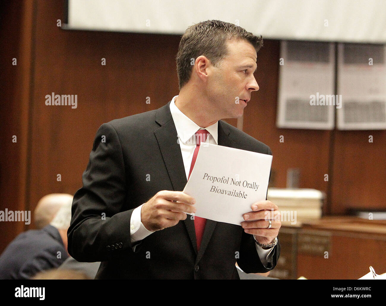 Deputy district attorney David Walgren holds a document during Dr ...