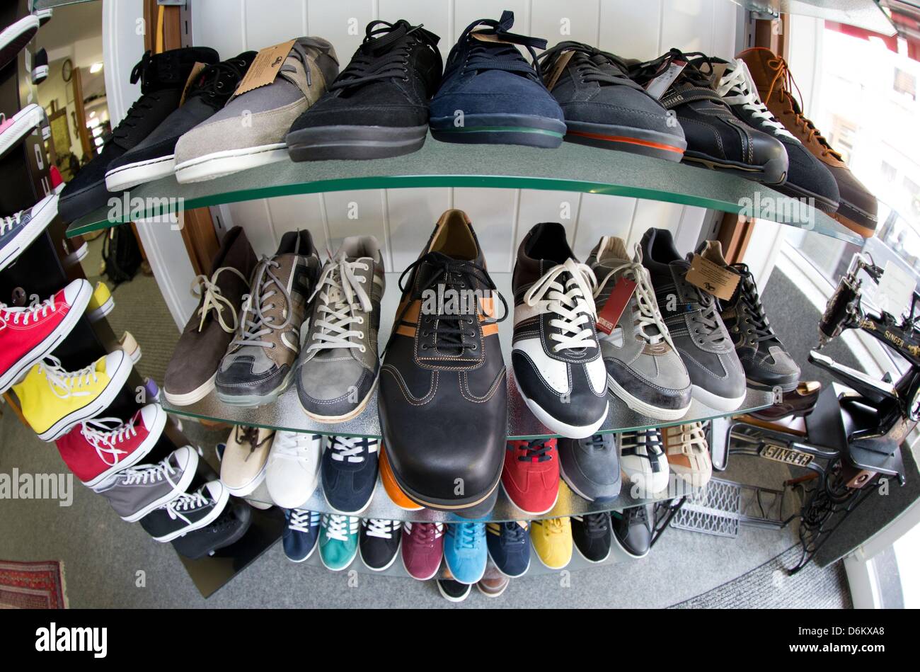 Oversized men's shoes stand on a shelf in the sales room of shoemaker ...
