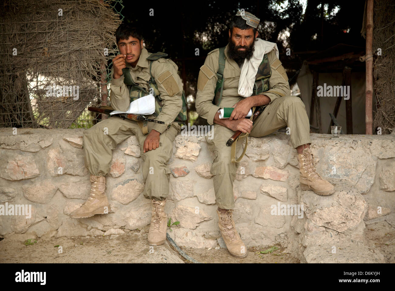Afghan Local Police officers prepare to meet with a Ministry of ...