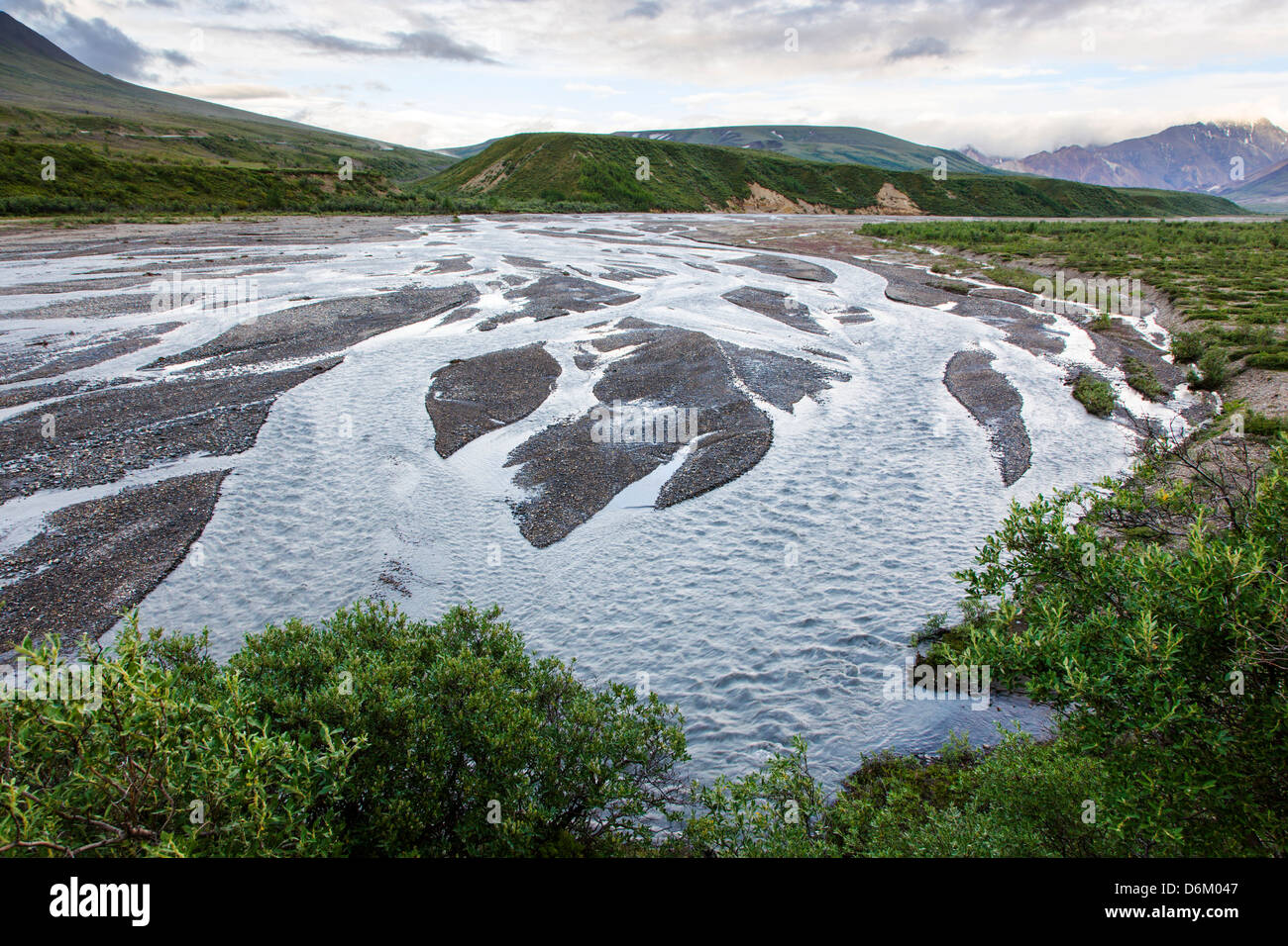 Dusk skies reflect in the braided East Fork of the Toklat River, Denali ...