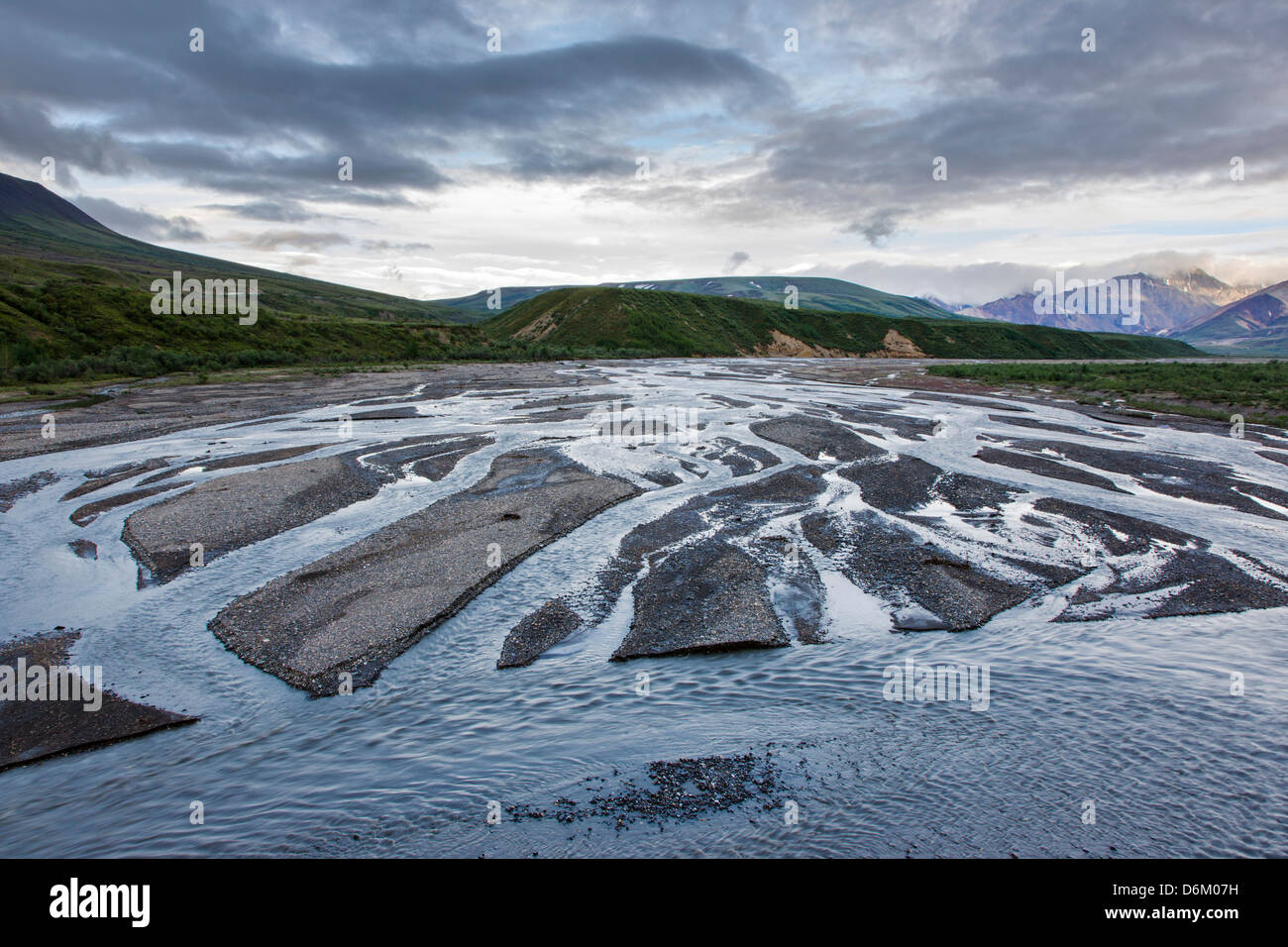 Dusk skies reflect in the braided East Fork of the Toklat River, Denali ...