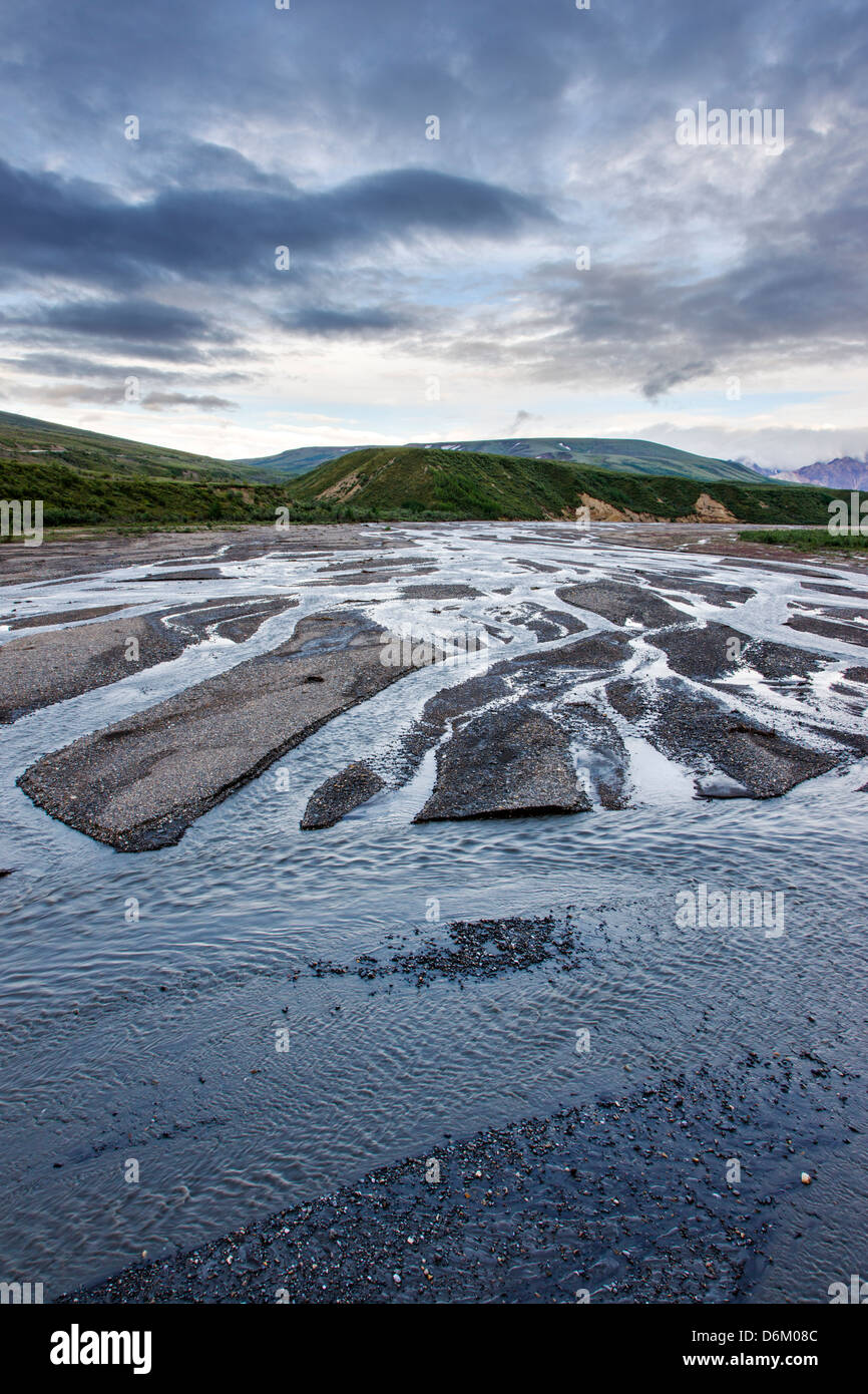 Dusk skies reflect in the braided East Fork of the Toklat River, Denali ...