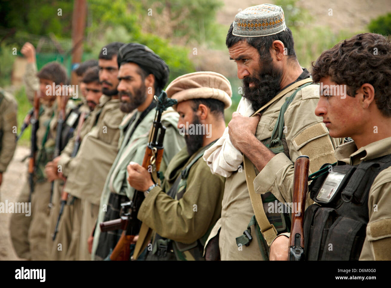 Afghan Local Police officers prepare to meet with a Ministry of ...