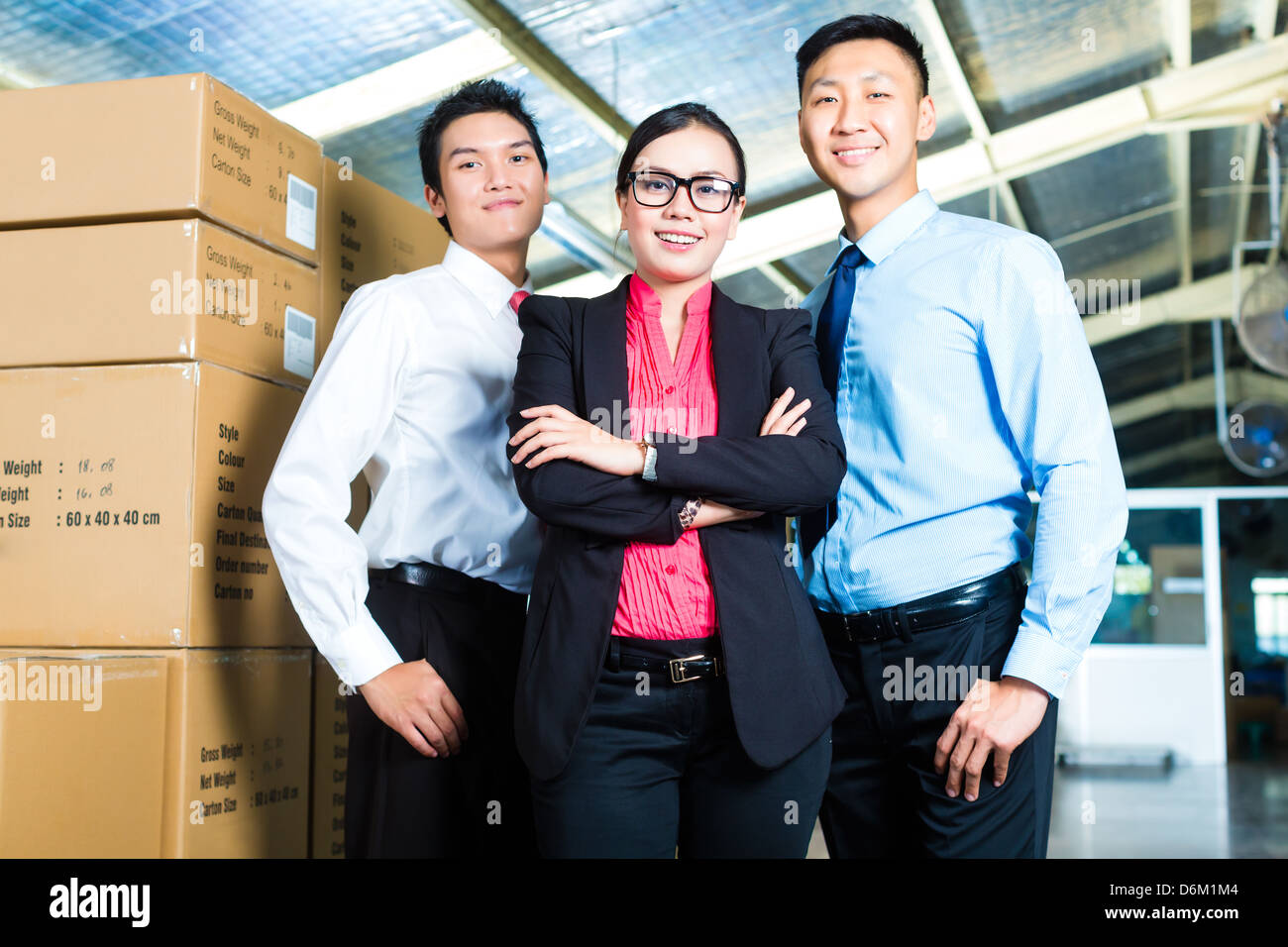Manager, owner or businesspeople in a warehouse of a forwarding agency ...