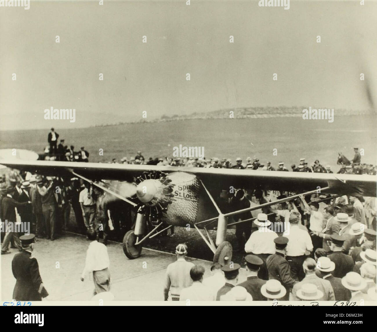 Charles Lindbergh, famed aviator, is greeted by a large crowd at Bettis ...